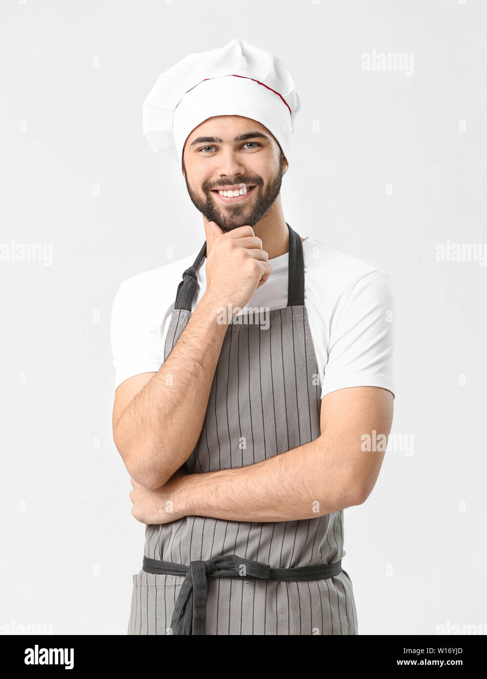 Handsome male chef on white background Stock Photo - Alamy