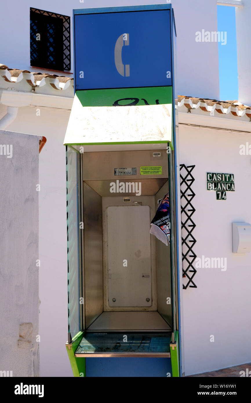 Pay phone booth without a telephone; removed for lack of business ...