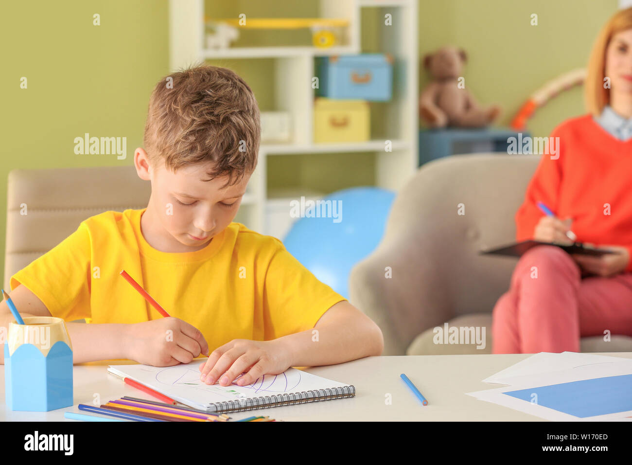 Little boy with autistic disorder at child psychologist's office Stock ...
