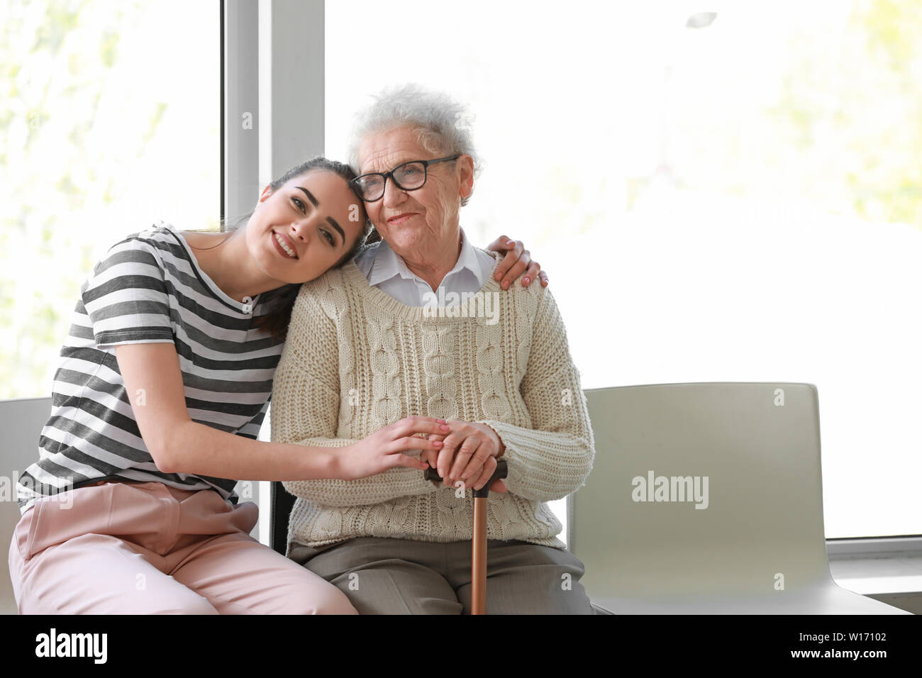 Caregiver with senior woman in nursing home Stock Photo - Alamy
