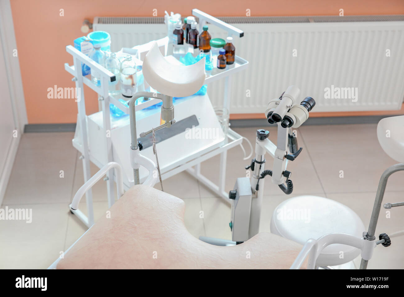 Gynecological chair with modern colposcope in clinic Stock Photo - Alamy