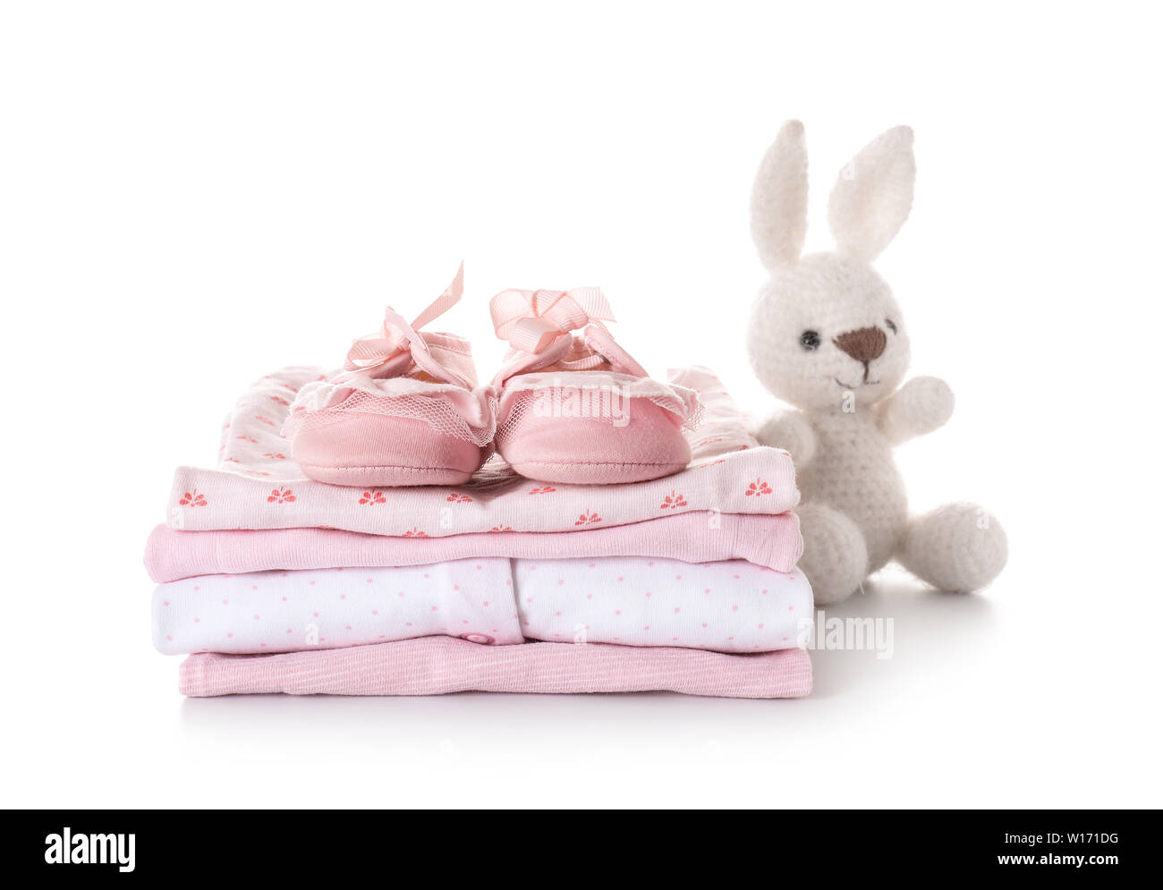 Stack of baby clothes on white background Stock Photo - Alamy