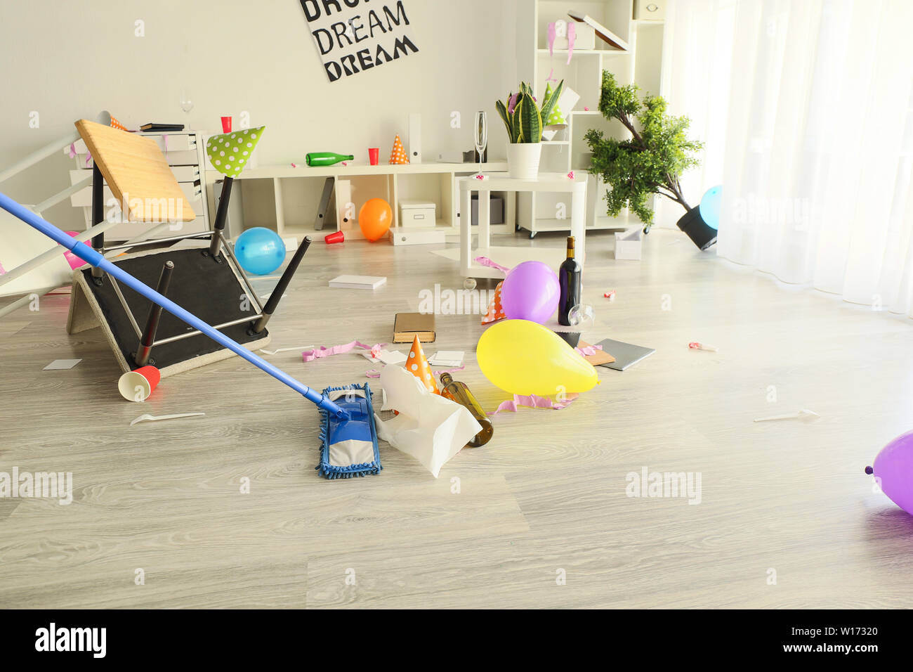 Cleaning of office after party Stock Photo - Alamy