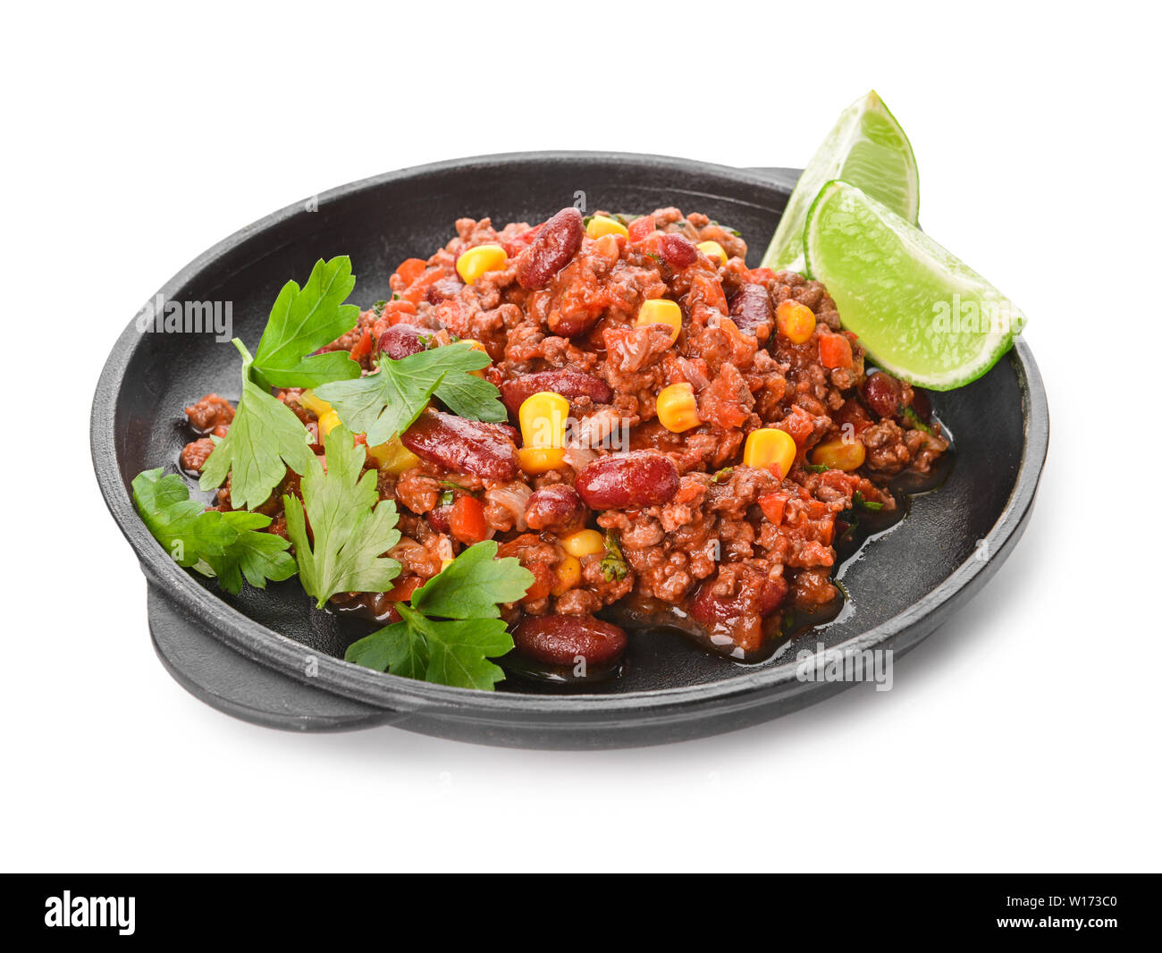 Frying pan with tasty chili con carne on white background Stock Photo ...