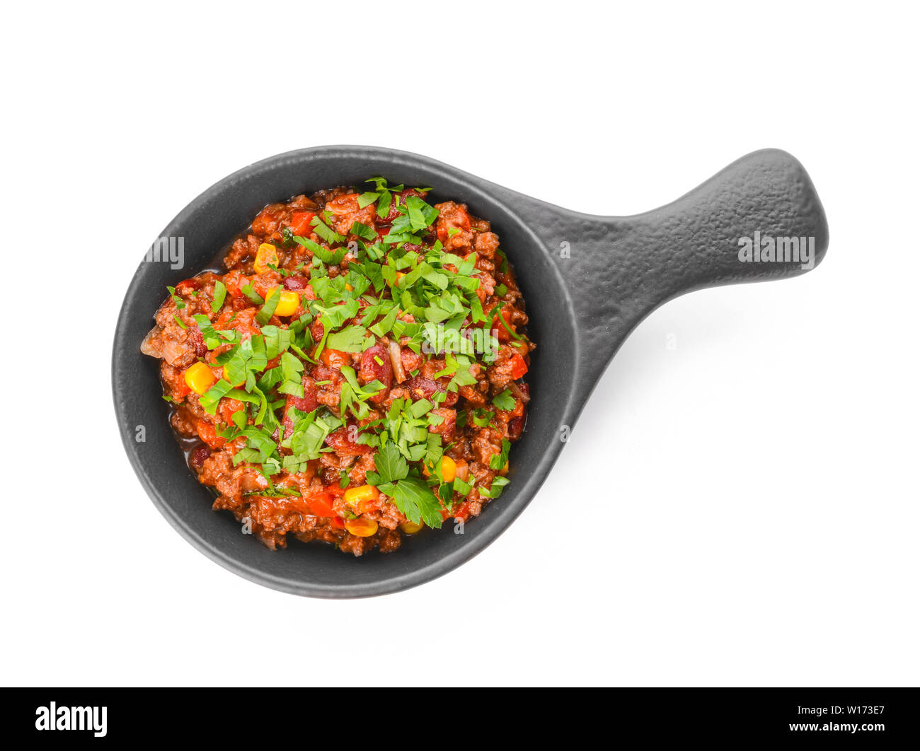 Frying pan with tasty chili con carne on white background Stock Photo ...