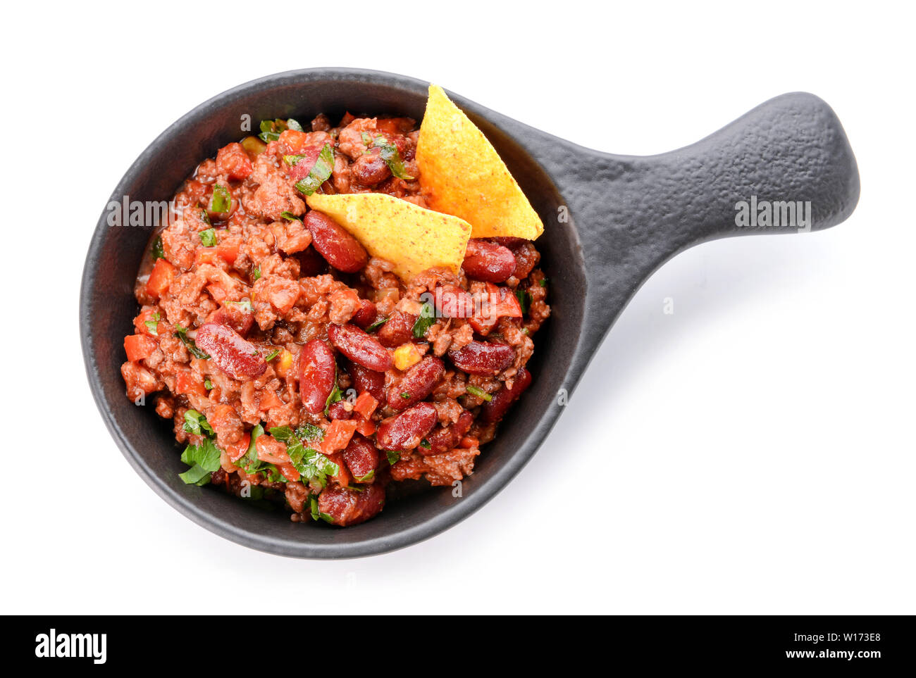 Frying pan with tasty chili con carne on white background Stock Photo ...