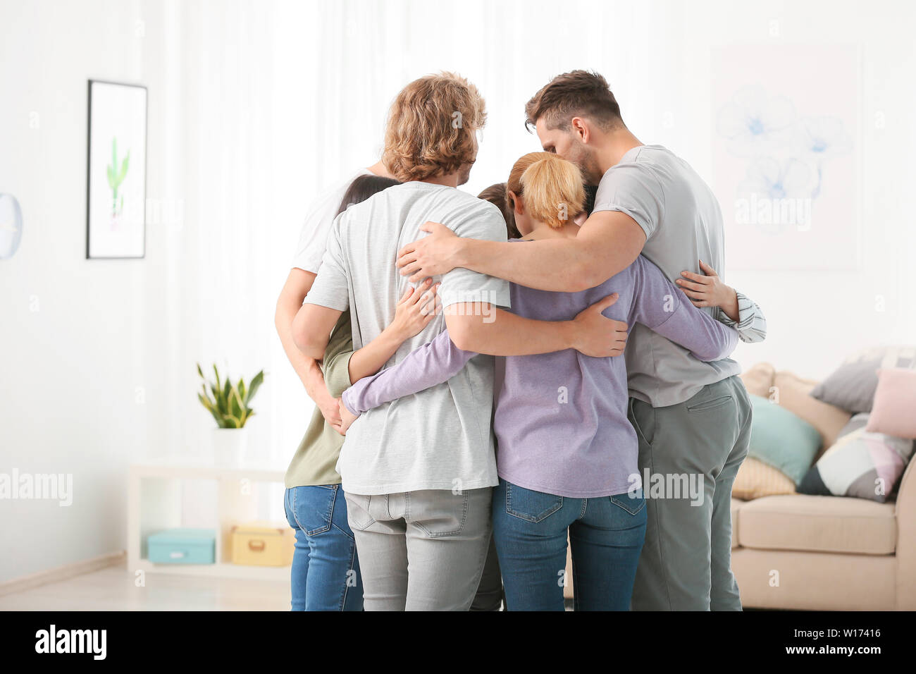 People hugging at group therapy session Stock Photo - Alamy