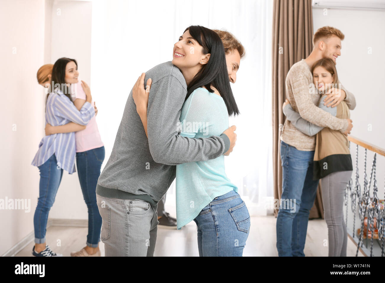 People hugging at group therapy session Stock Photo - Alamy