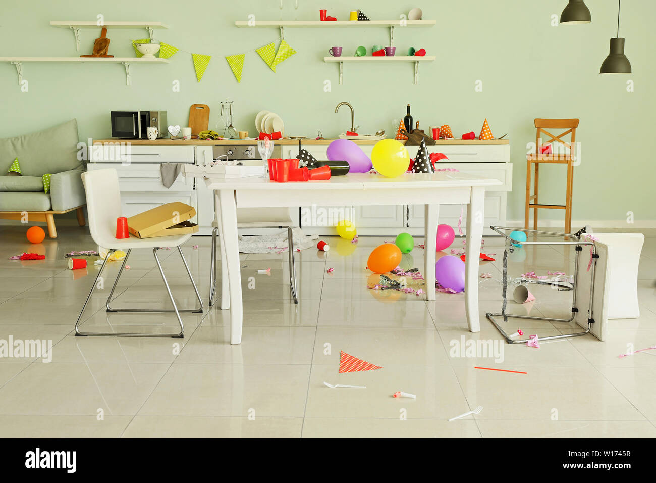 Interior of kitchen after party Stock Photo - Alamy