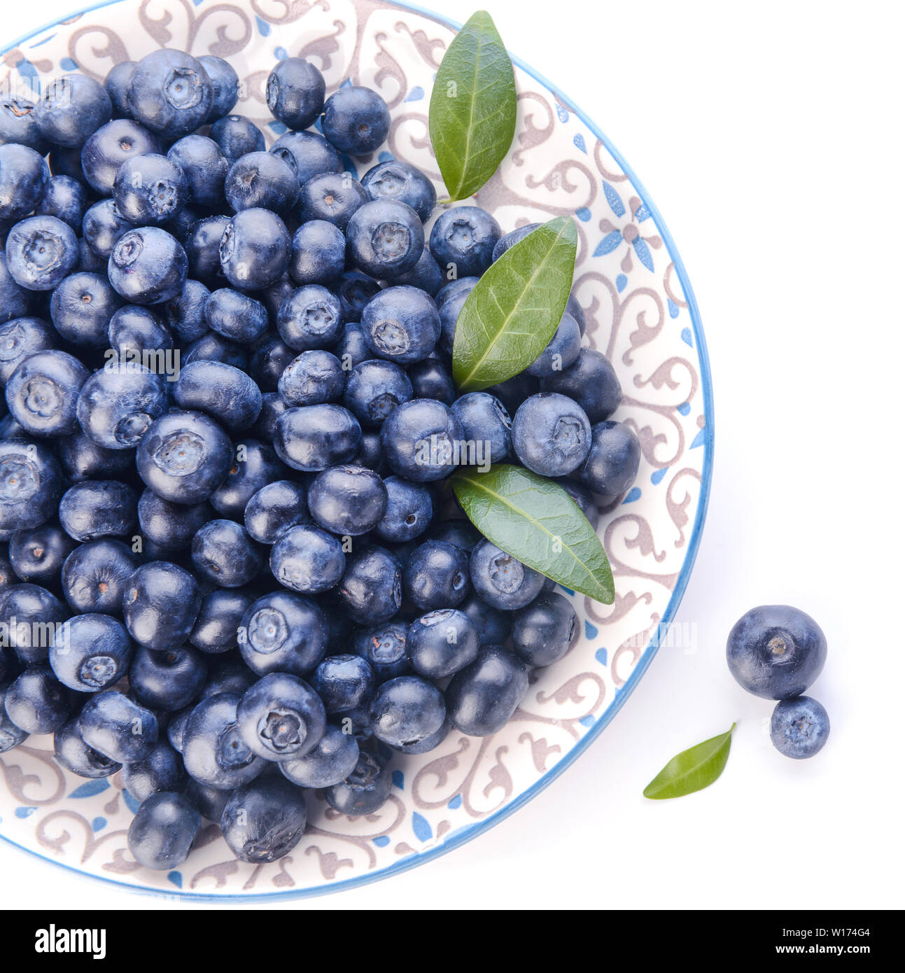 Plate with ripe blueberry on white background Stock Photo - Alamy