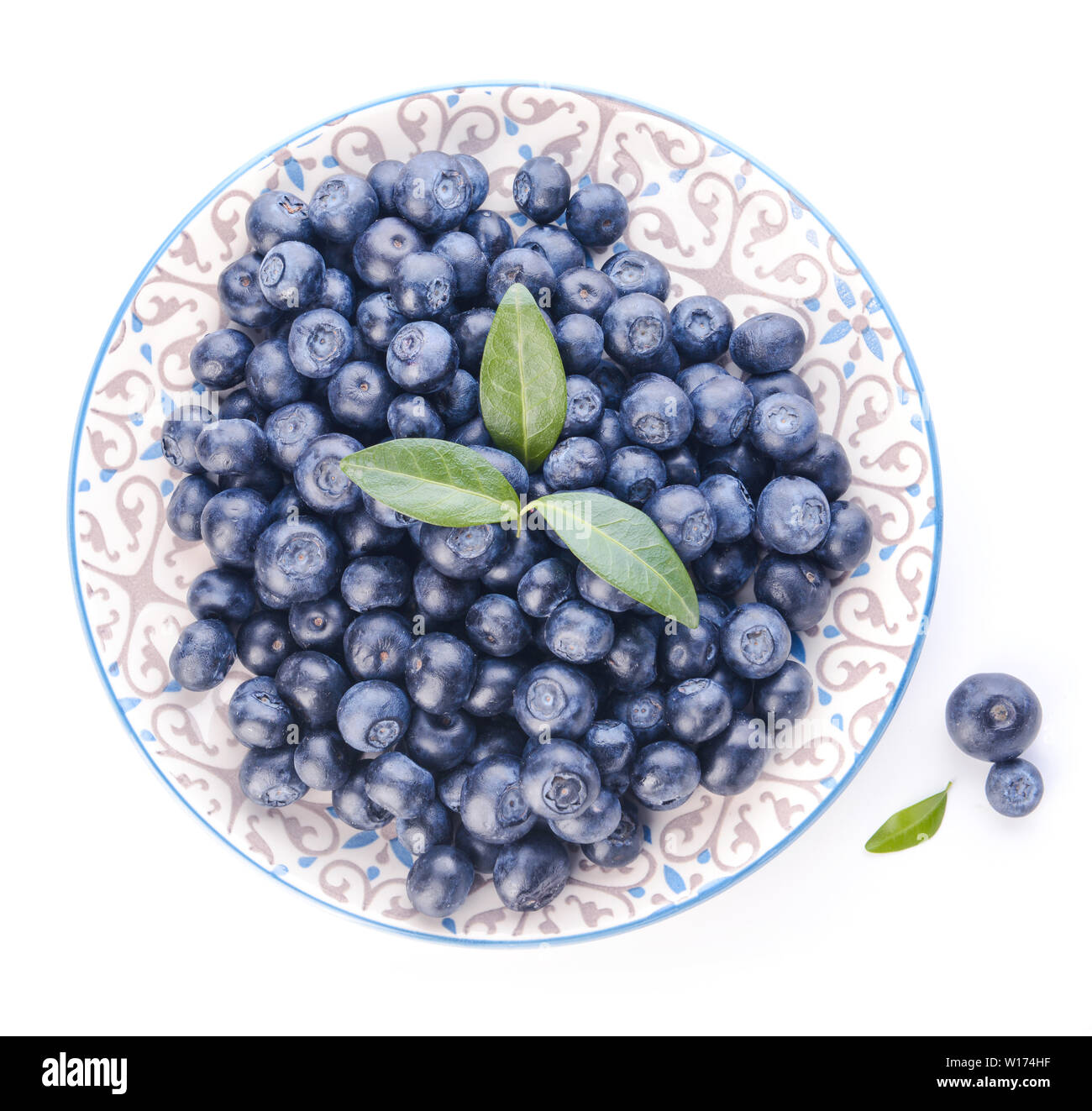 Plate with ripe blueberry on white background Stock Photo - Alamy