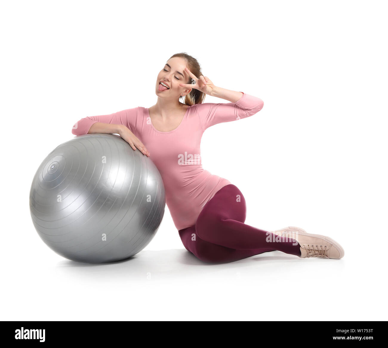 Young sporty woman with fitball on white background Stock Photo - Alamy