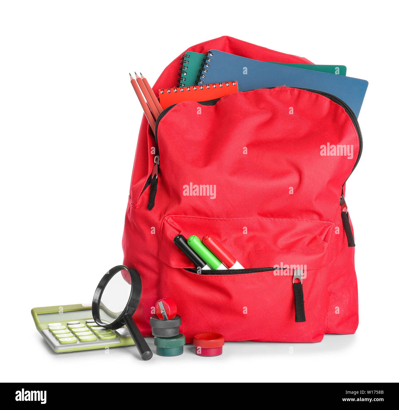 School backpack with stationery on white background Stock Photo - Alamy