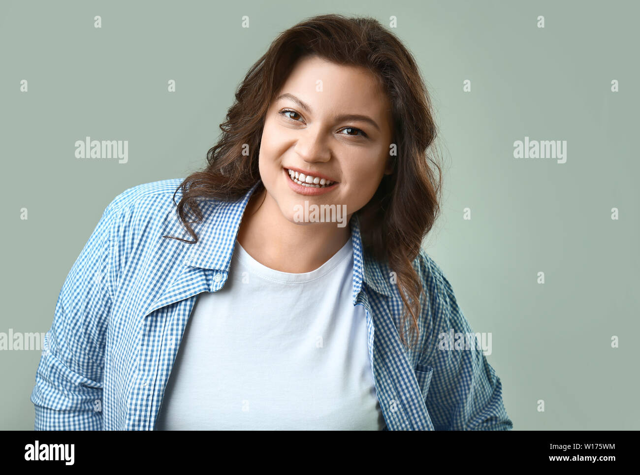 Beautiful plus size woman on grey background. Concept of body positive ...