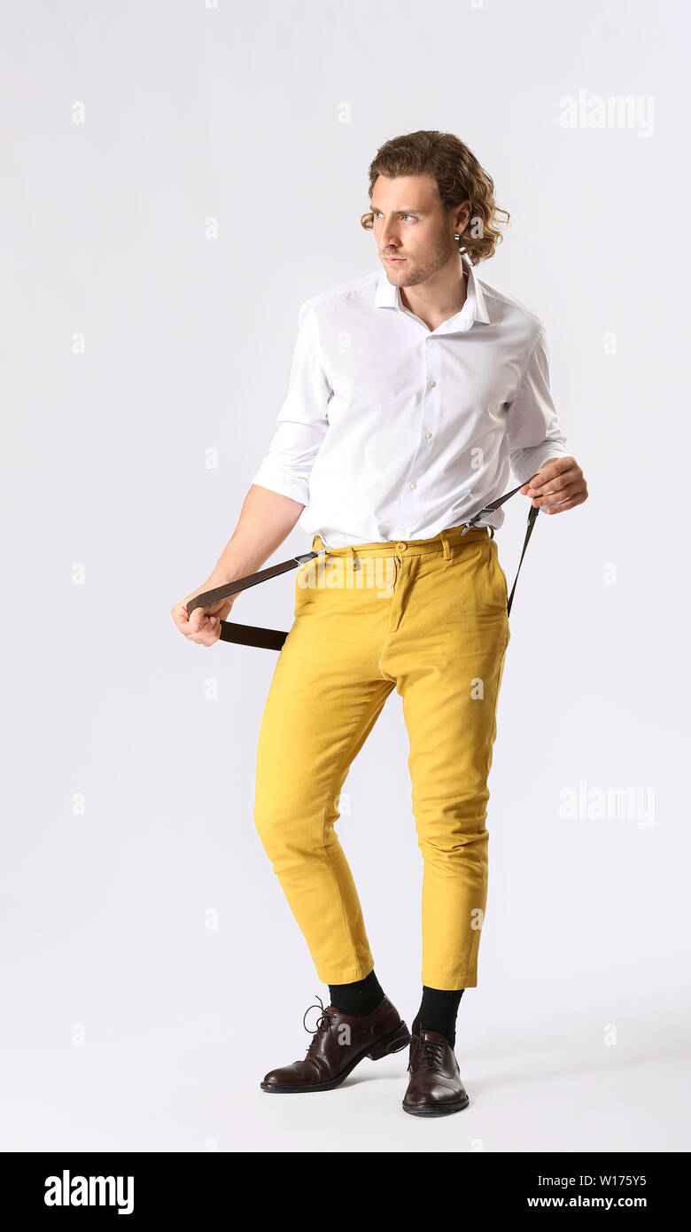 Stylish young man on white background Stock Photo - Alamy