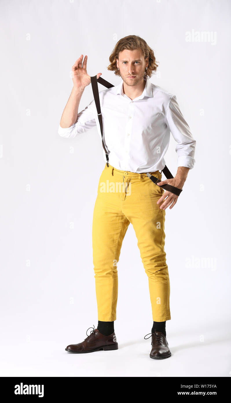 Stylish young man on white background Stock Photo - Alamy