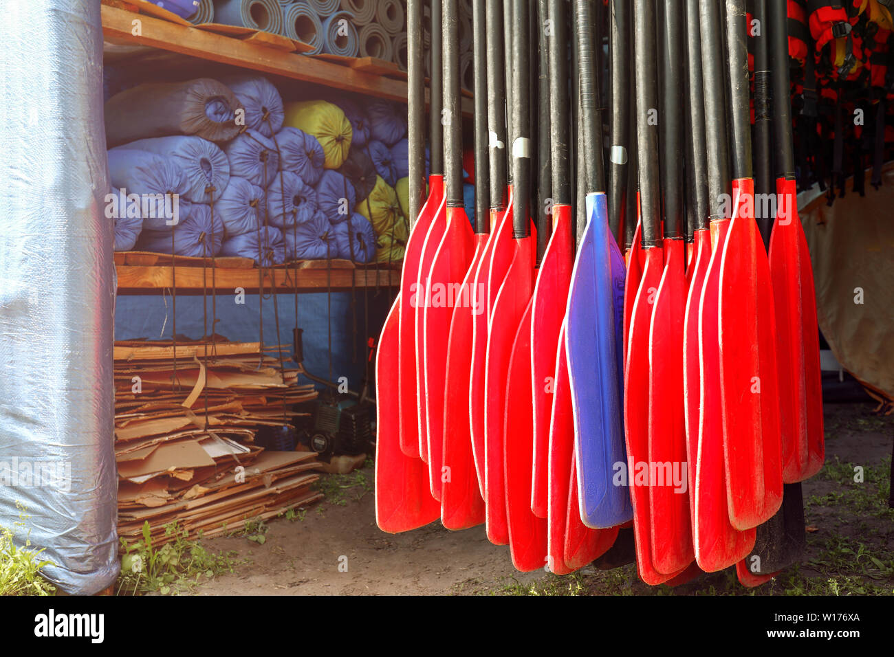 Paddles for raft in warehouse Stock Photo - Alamy