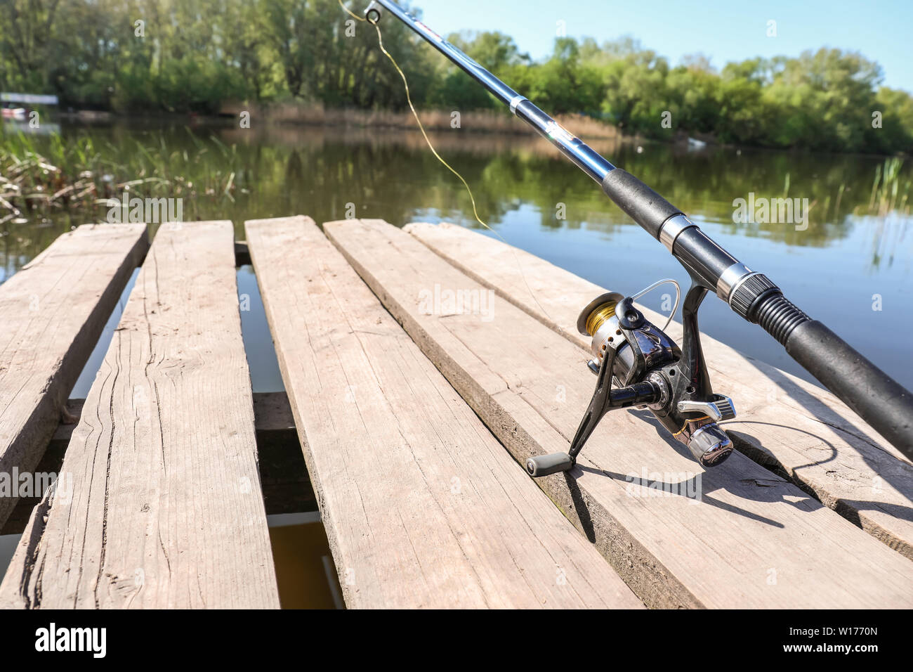 Fishing rod on pier hi-res stock photography and images - Alamy