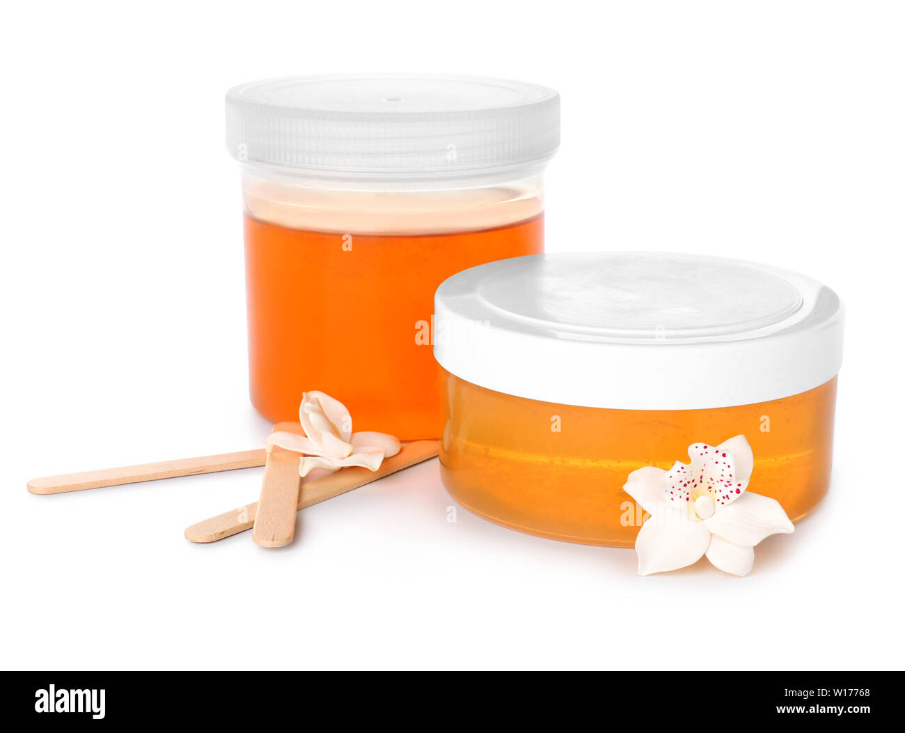 Containers with sugaring paste for epilation on white background Stock ...