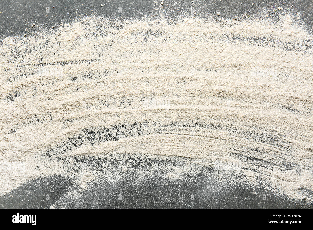 Fresh flour on grey background Stock Photo - Alamy