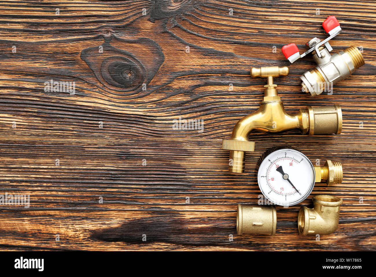 Set of plumbing items on wooden background Stock Photo - Alamy