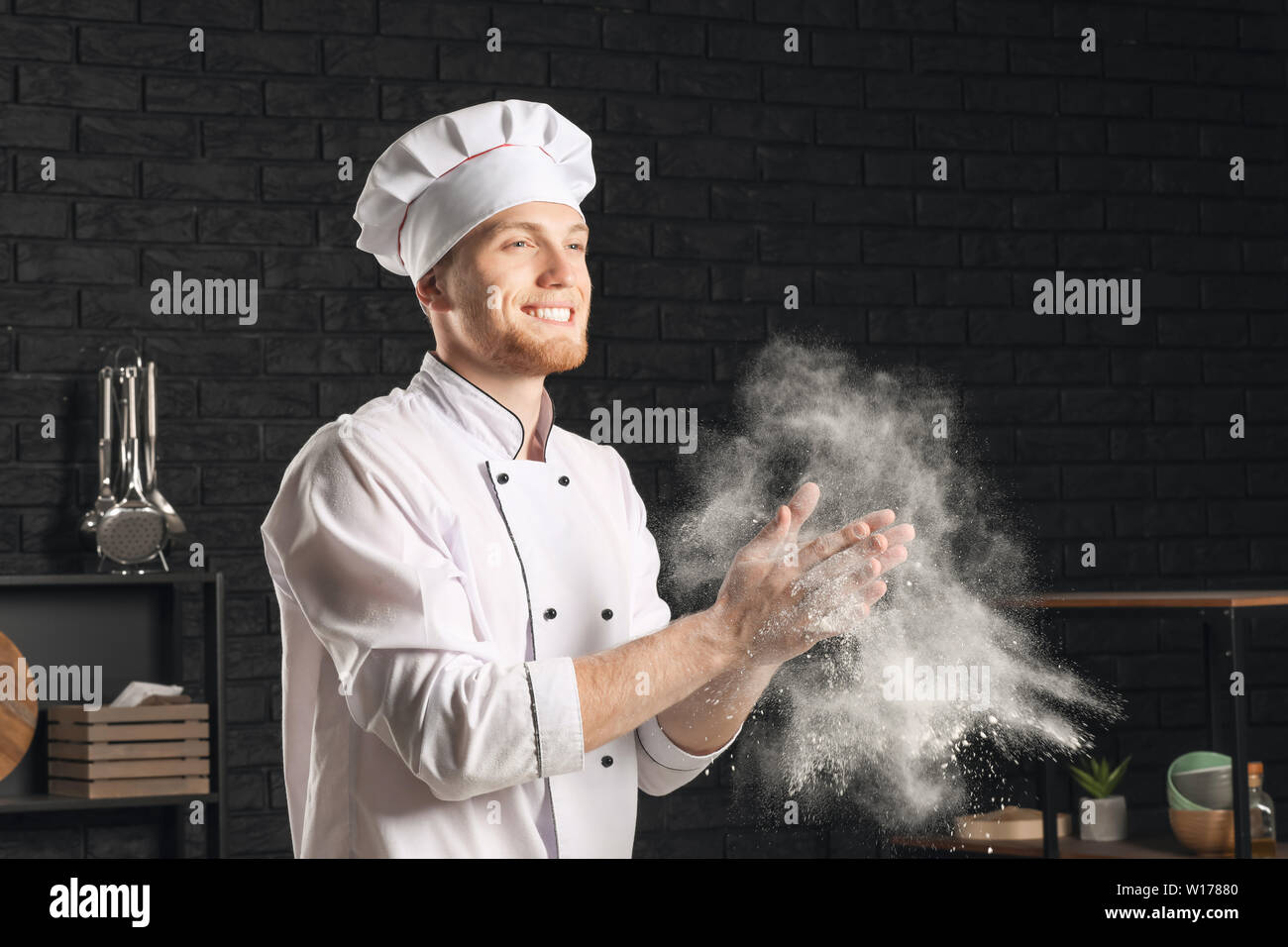 Male chef clapping hands with flour in kitchen Stock Photo - Alamy