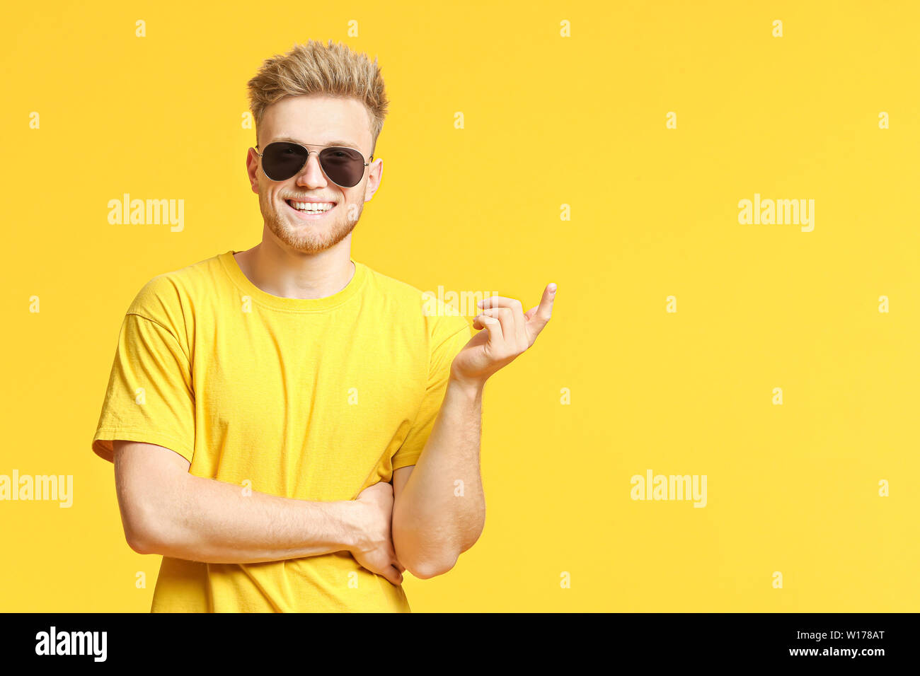Portrait of handsome young man on color background Stock Photo - Alamy