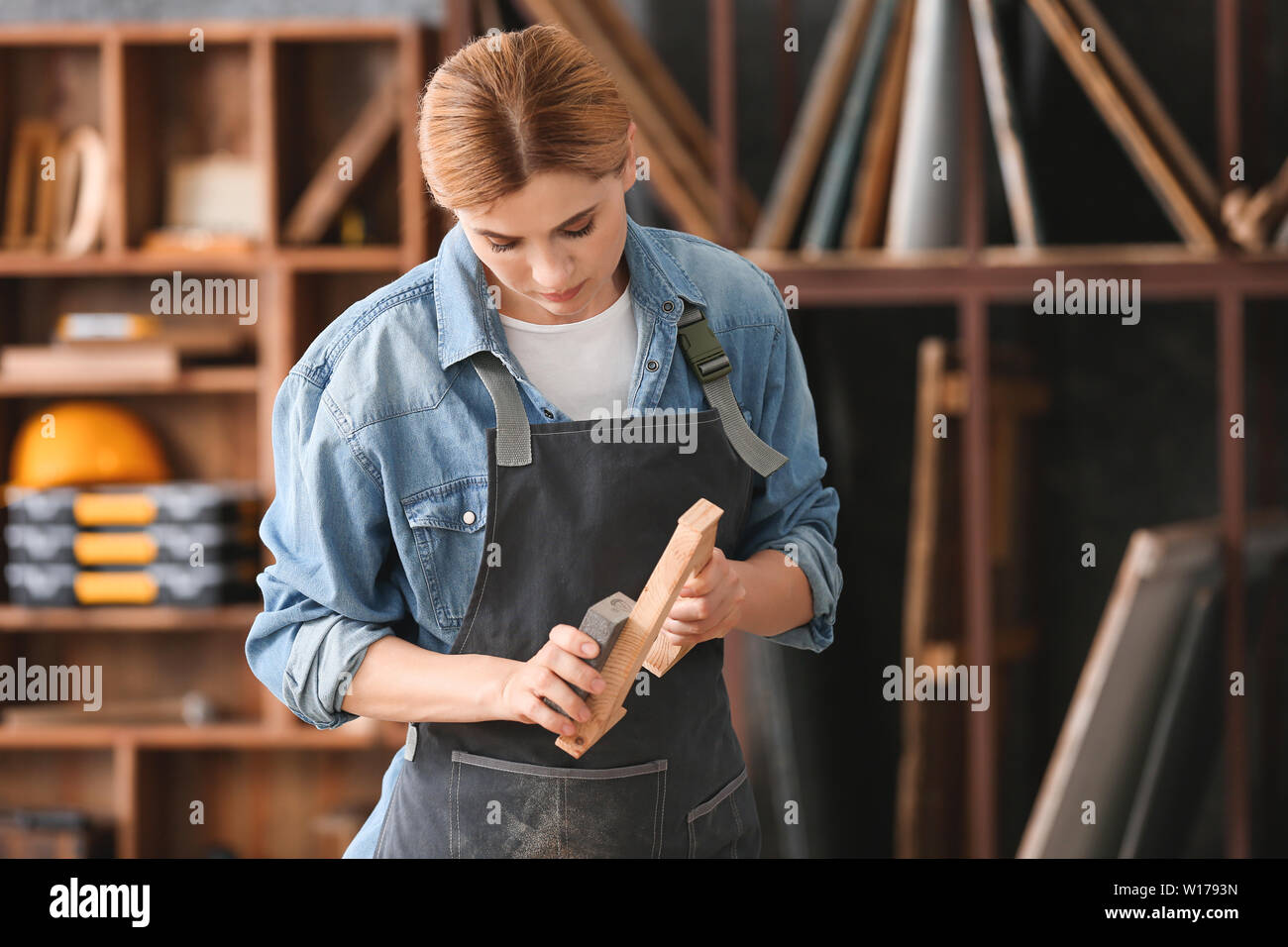 Female carpenter working in shop Stock Photo - Alamy