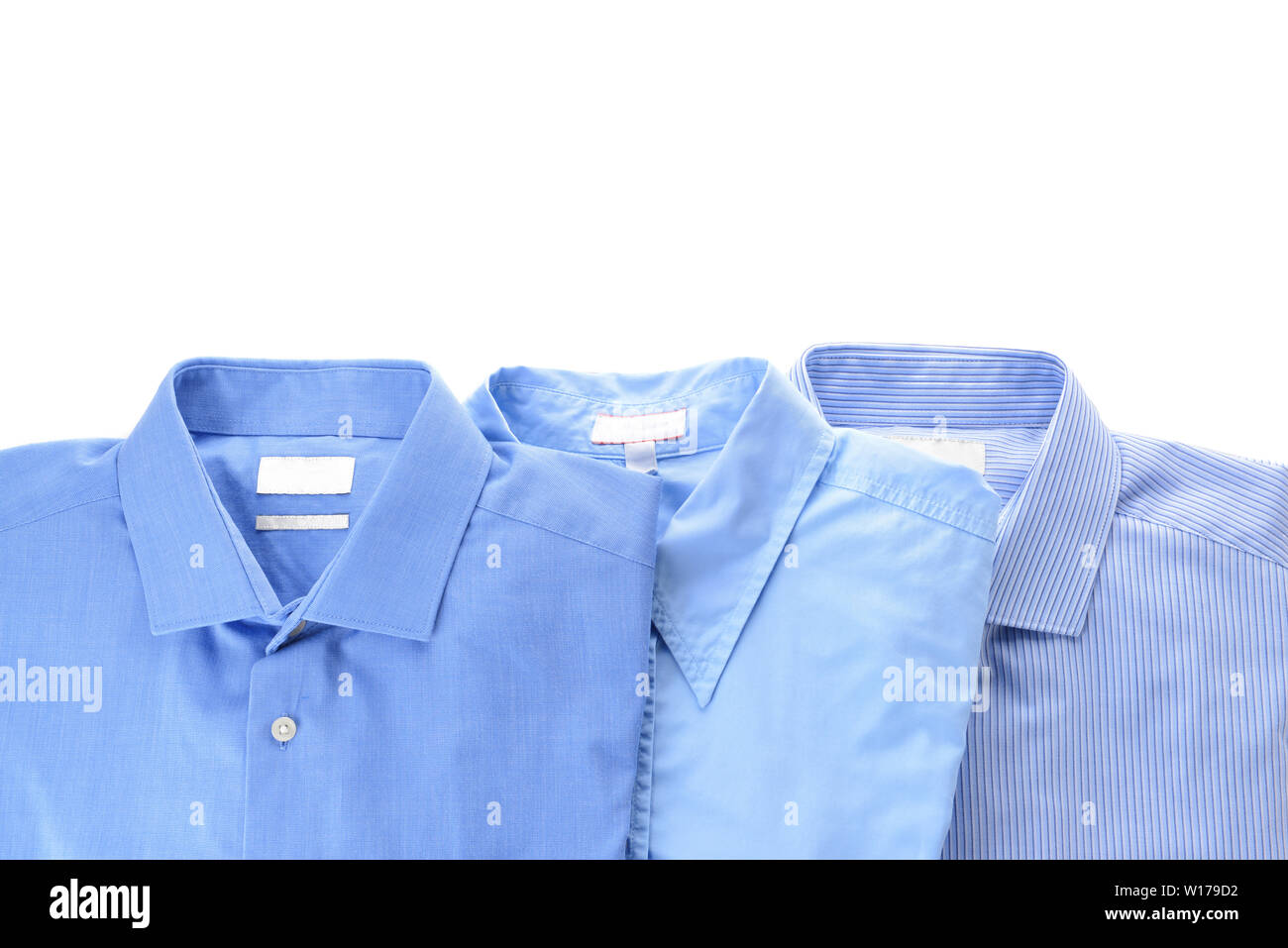 Shirts after dry-cleaning on white background Stock Photo - Alamy