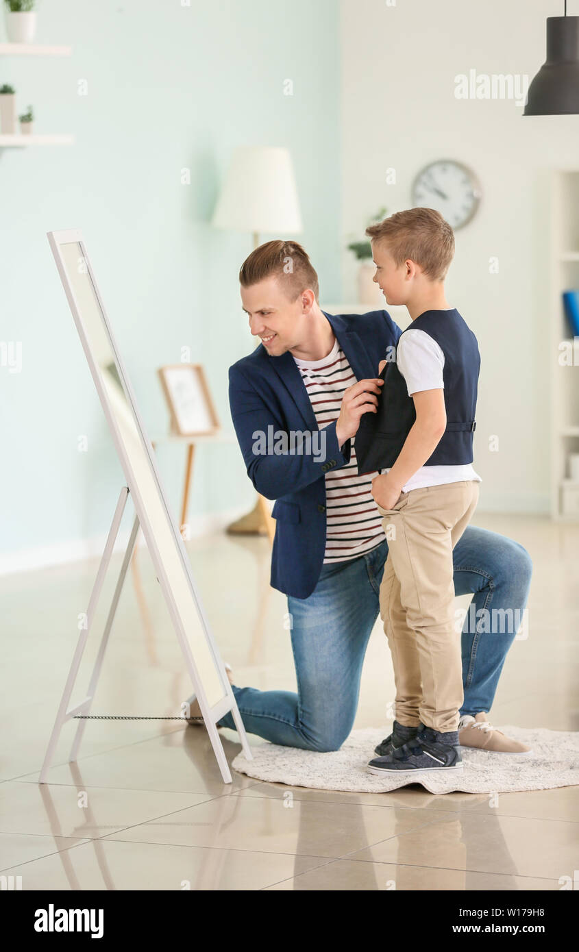Father and son in fashionable clothes at home Stock Photo - Alamy