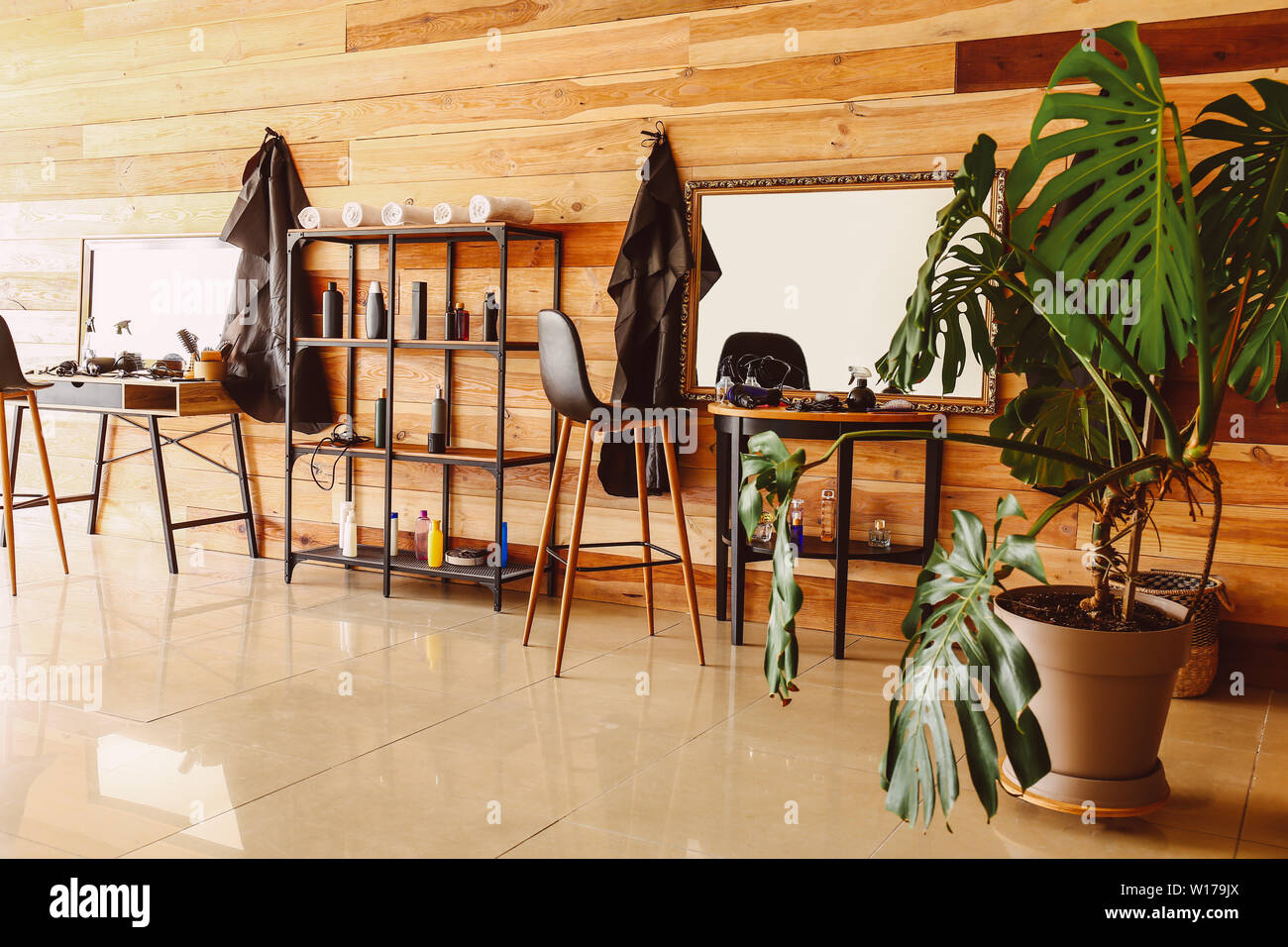 Interior of modern hairdressing salon Stock Photo - Alamy