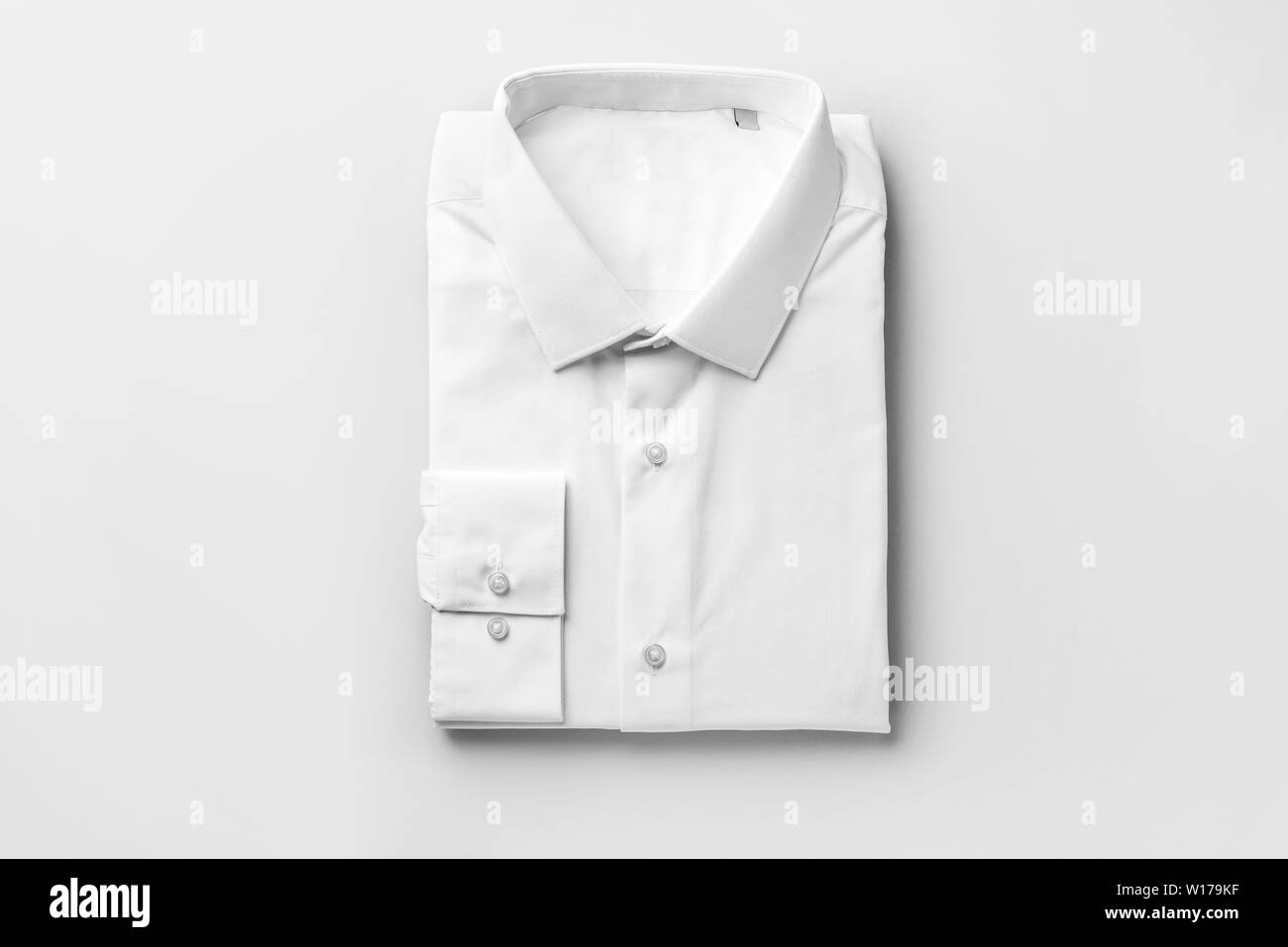 Shirt after dry-cleaning on light background Stock Photo - Alamy