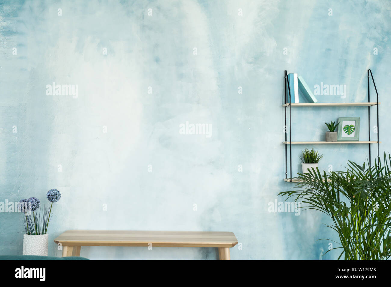 Interior of room with table and shelves Stock Photo - Alamy