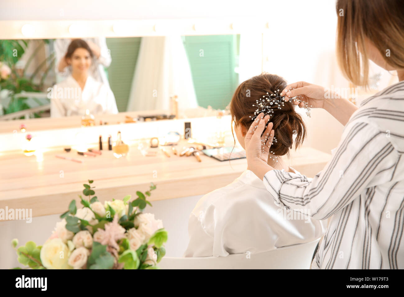 Professional hairdresser working with young bride at home Stock Photo ...