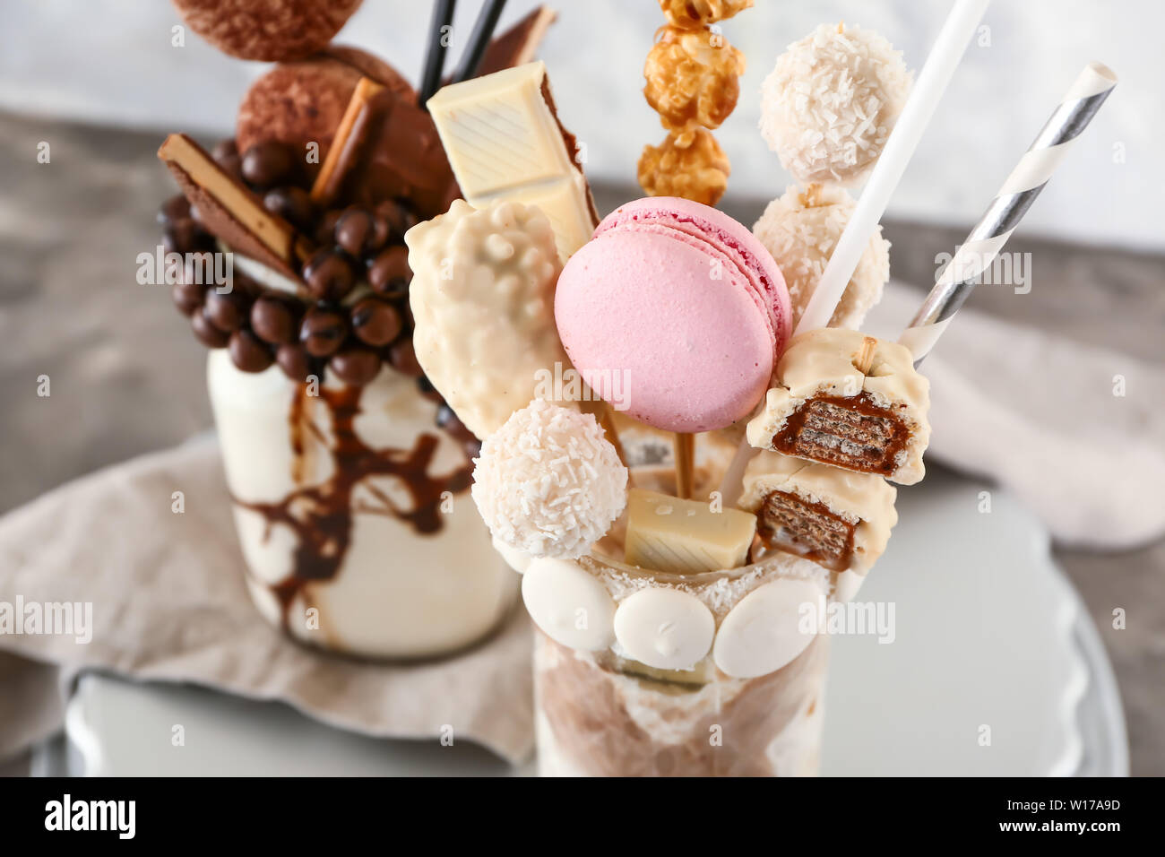 Delicious freak shake on table, closeup Stock Photo - Alamy