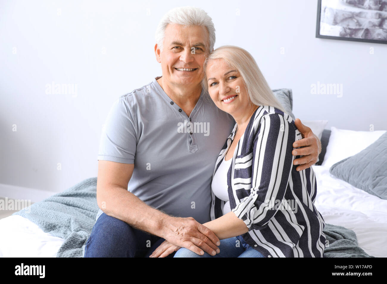 Portrait of happy mature couple in bedroom Stock Photo - Alamy