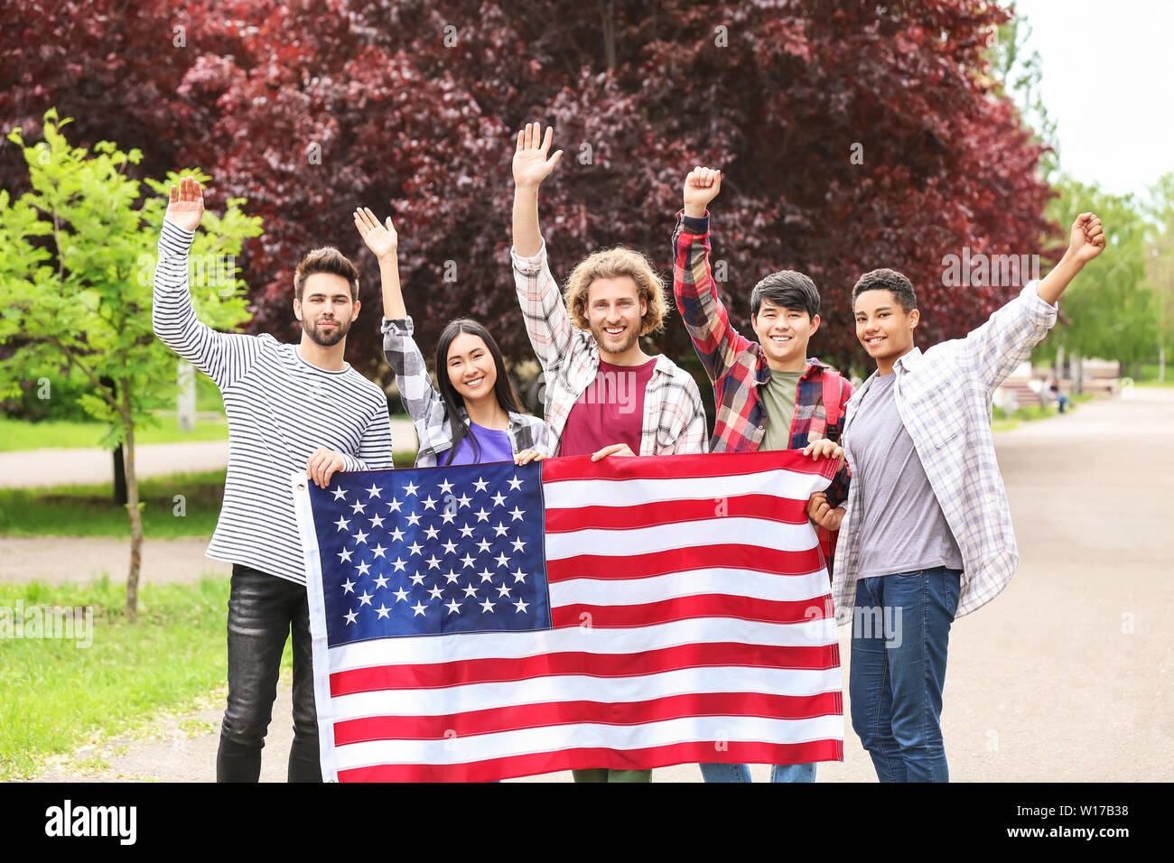 Group of students with USA flag outdoors Stock Photo - Alamy