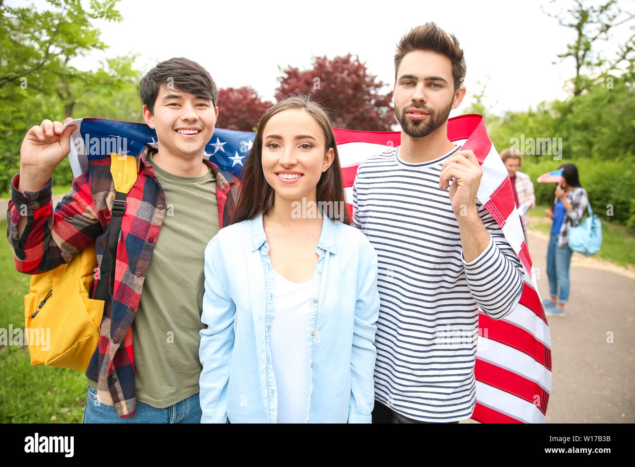 Group of students with USA flag outdoors Stock Photo - Alamy