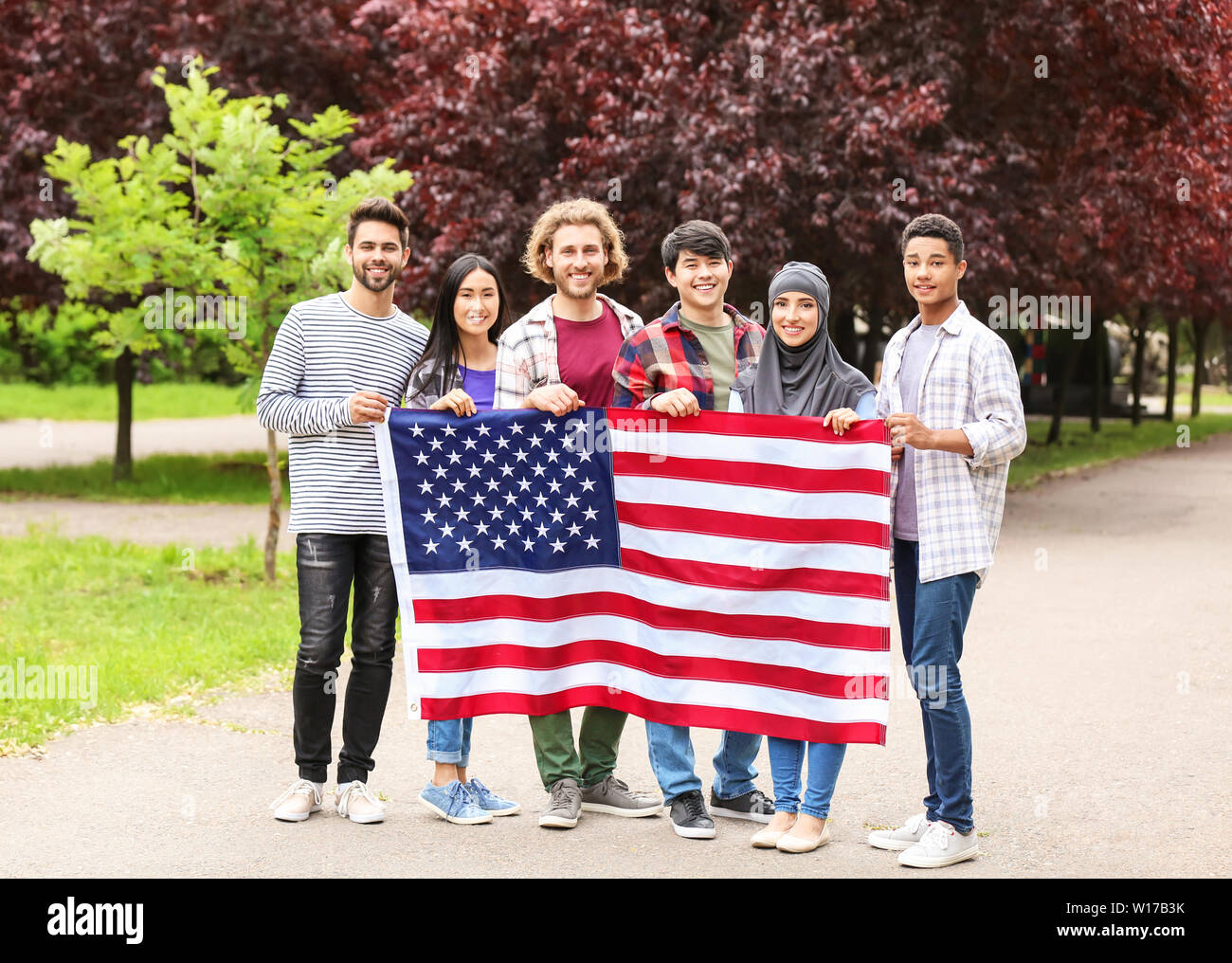 Group of students with USA flag outdoors Stock Photo - Alamy