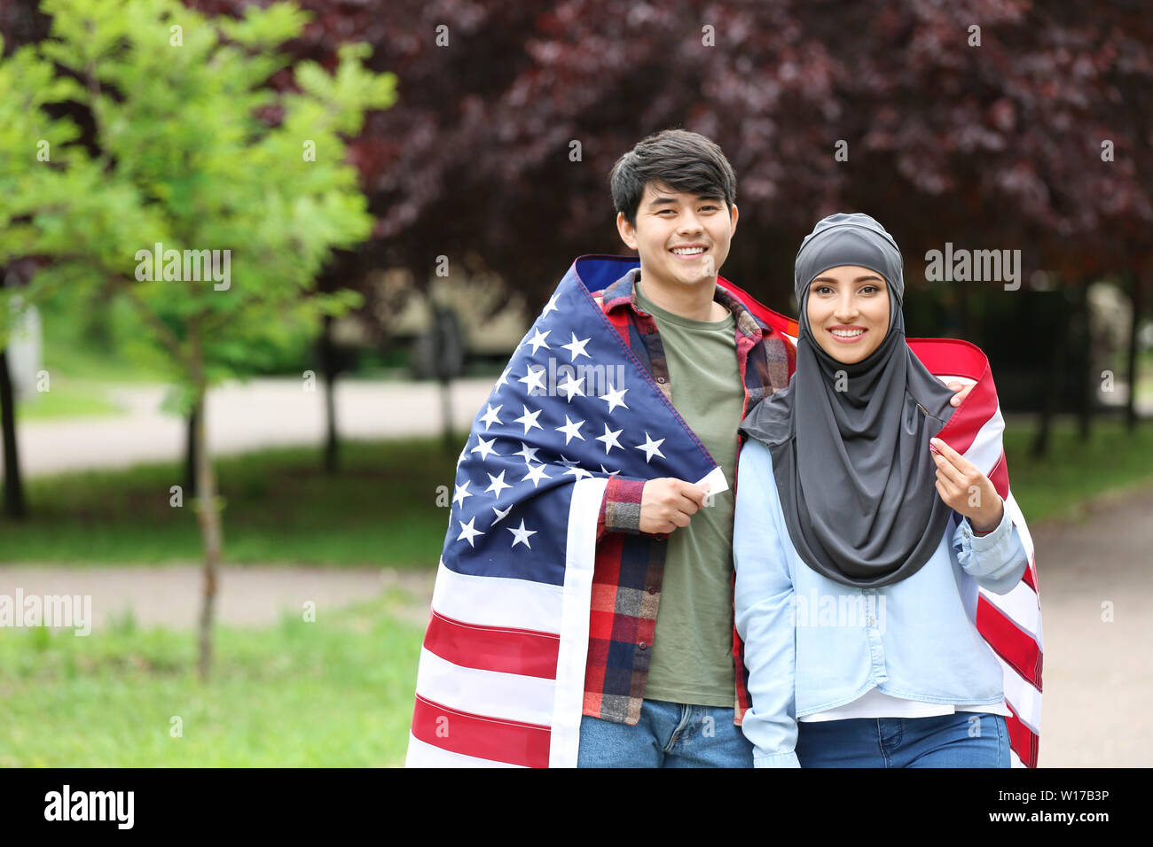Young students with USA flag outdoors Stock Photo - Alamy