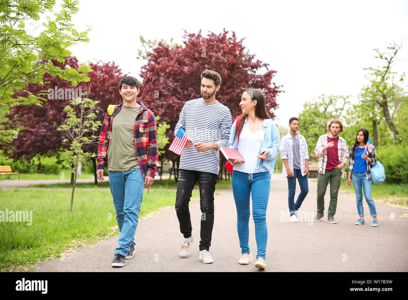Group of students with USA flags outdoors Stock Photo - Alamy
