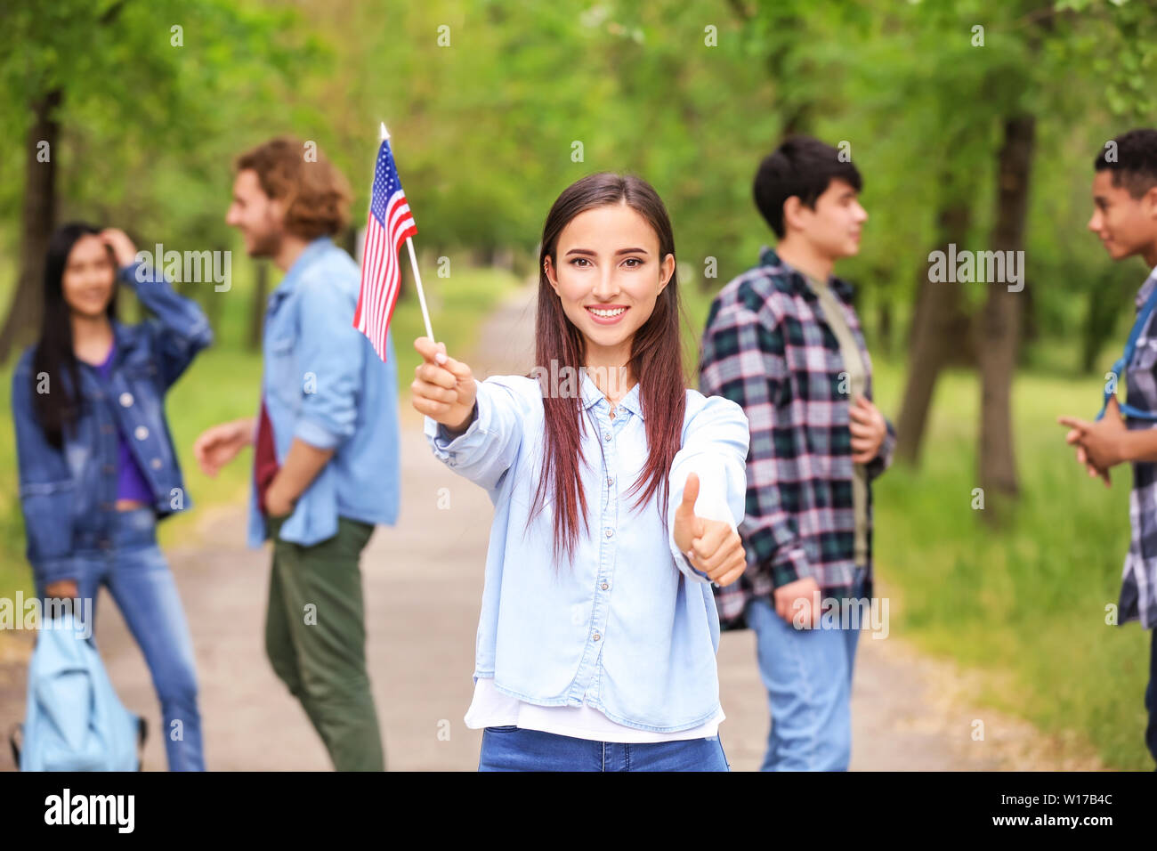 Female student with USA flag outdoors Stock Photo - Alamy