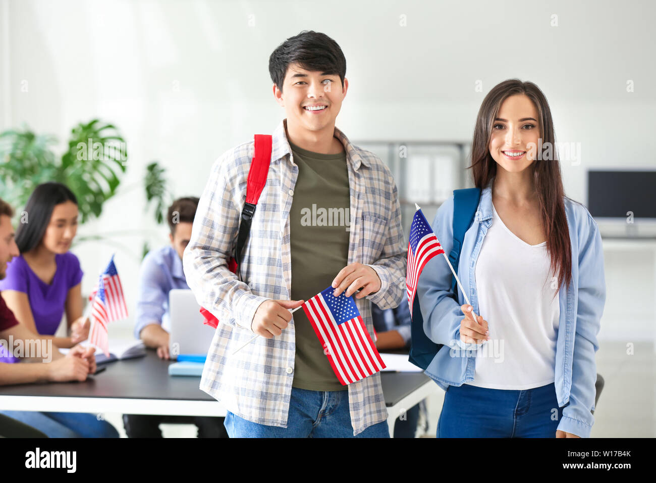 Students with USA flags in classroom Stock Photo - Alamy