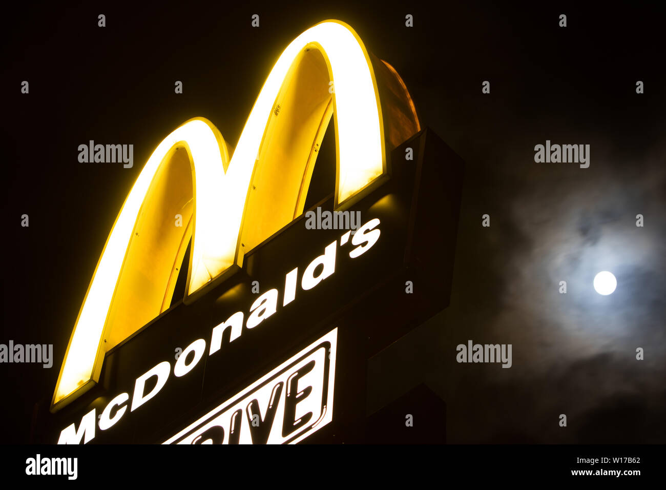 Lodz, Poland, Jan 2018 yellow McDonald's sign, night, clouds, moon in ...