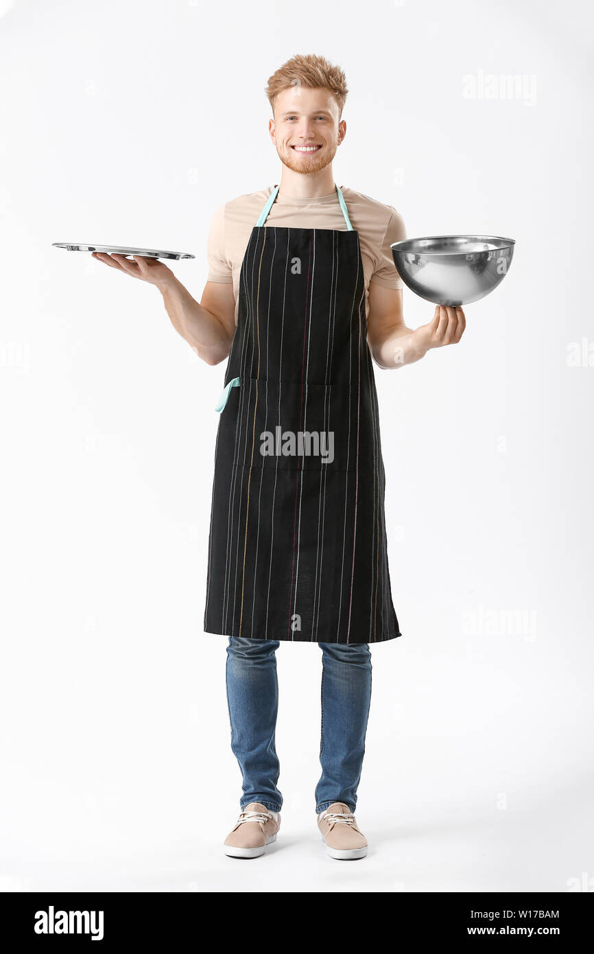 Handsome male chef with tray and cloche on white background Stock Photo ...