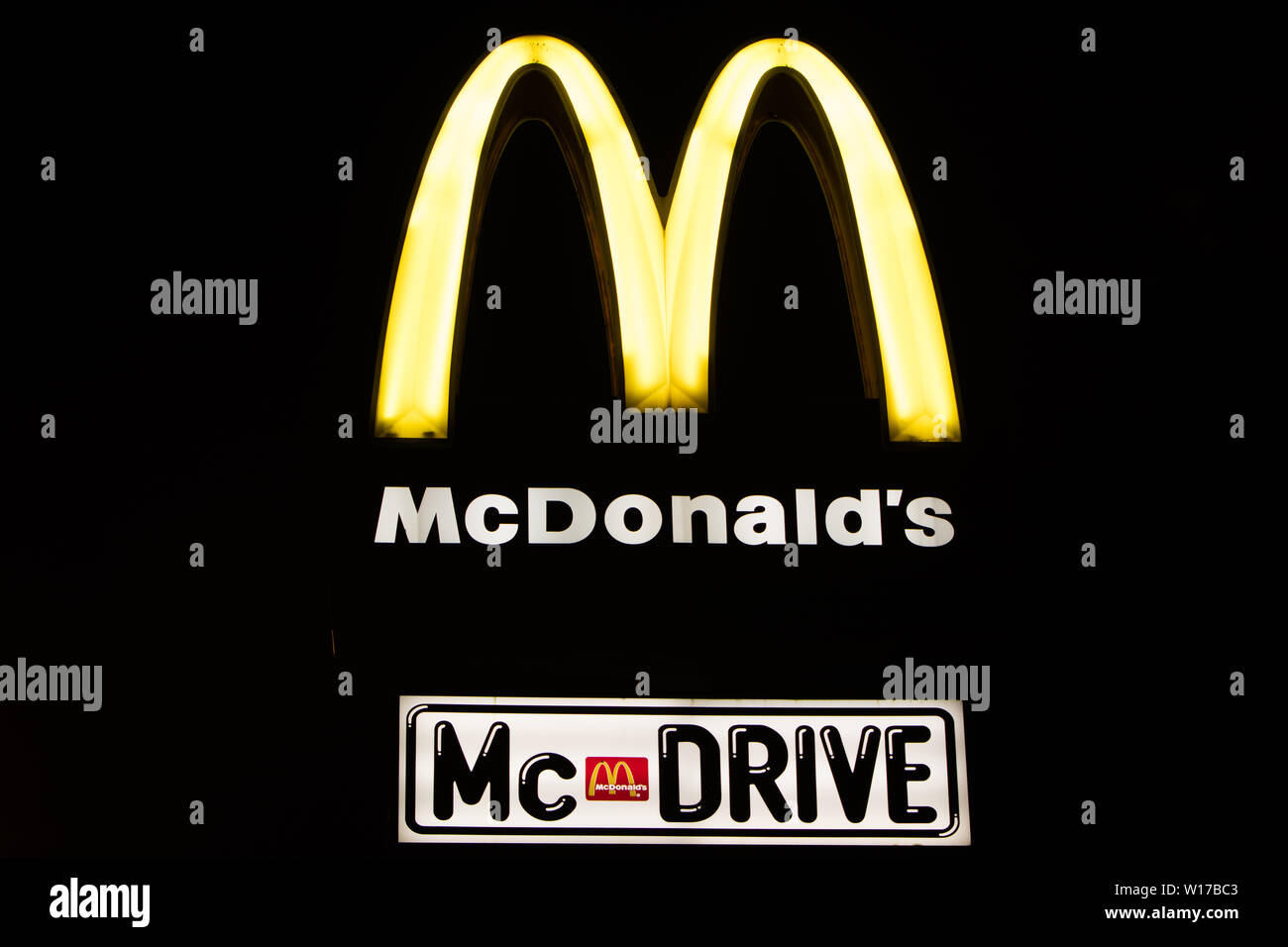 Lodz, Poland, Jan 2018 yellow McDonald's sign, night, clouds in ...