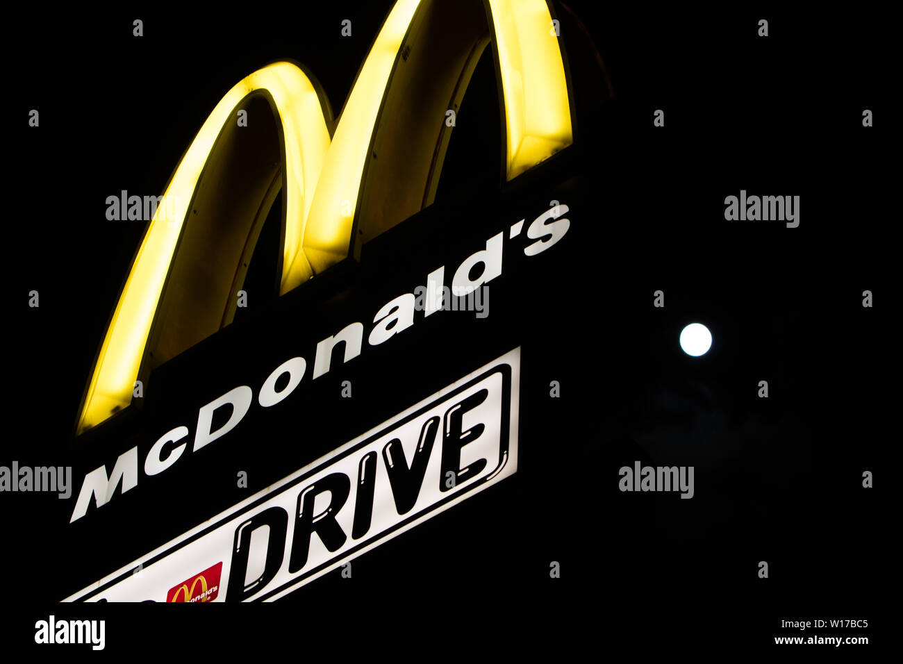 Lodz, Poland, Jan 2018 yellow McDonald's sign, night, clouds, moon in ...