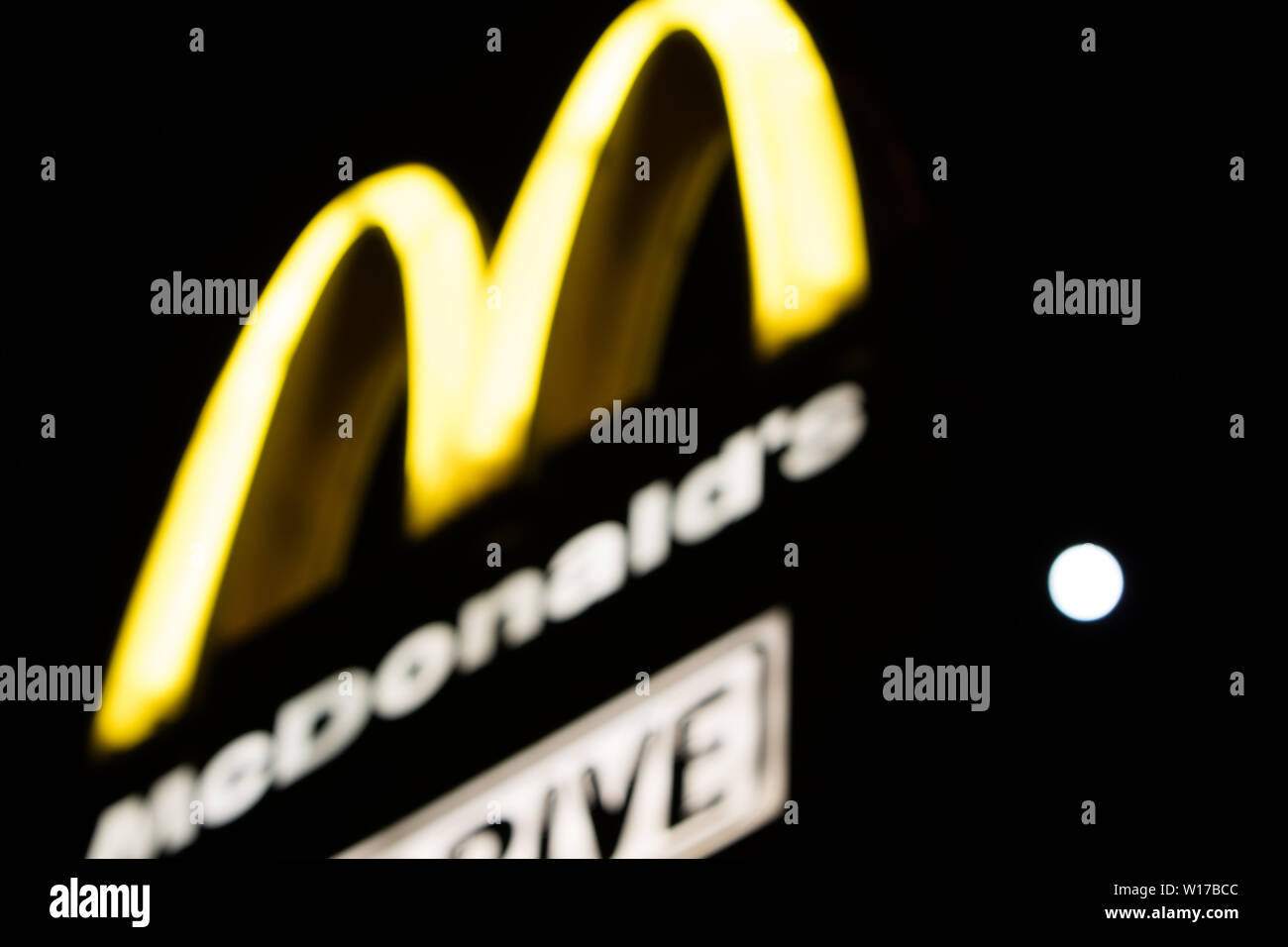 Lodz, Poland, Jan 2018 yellow McDonald's sign, night, clouds, moon in ...