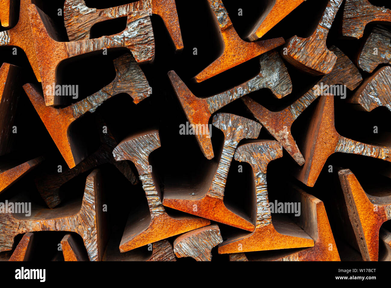 A stack of scrap flat-bottomed rail in a large pile awaiting recycling ...