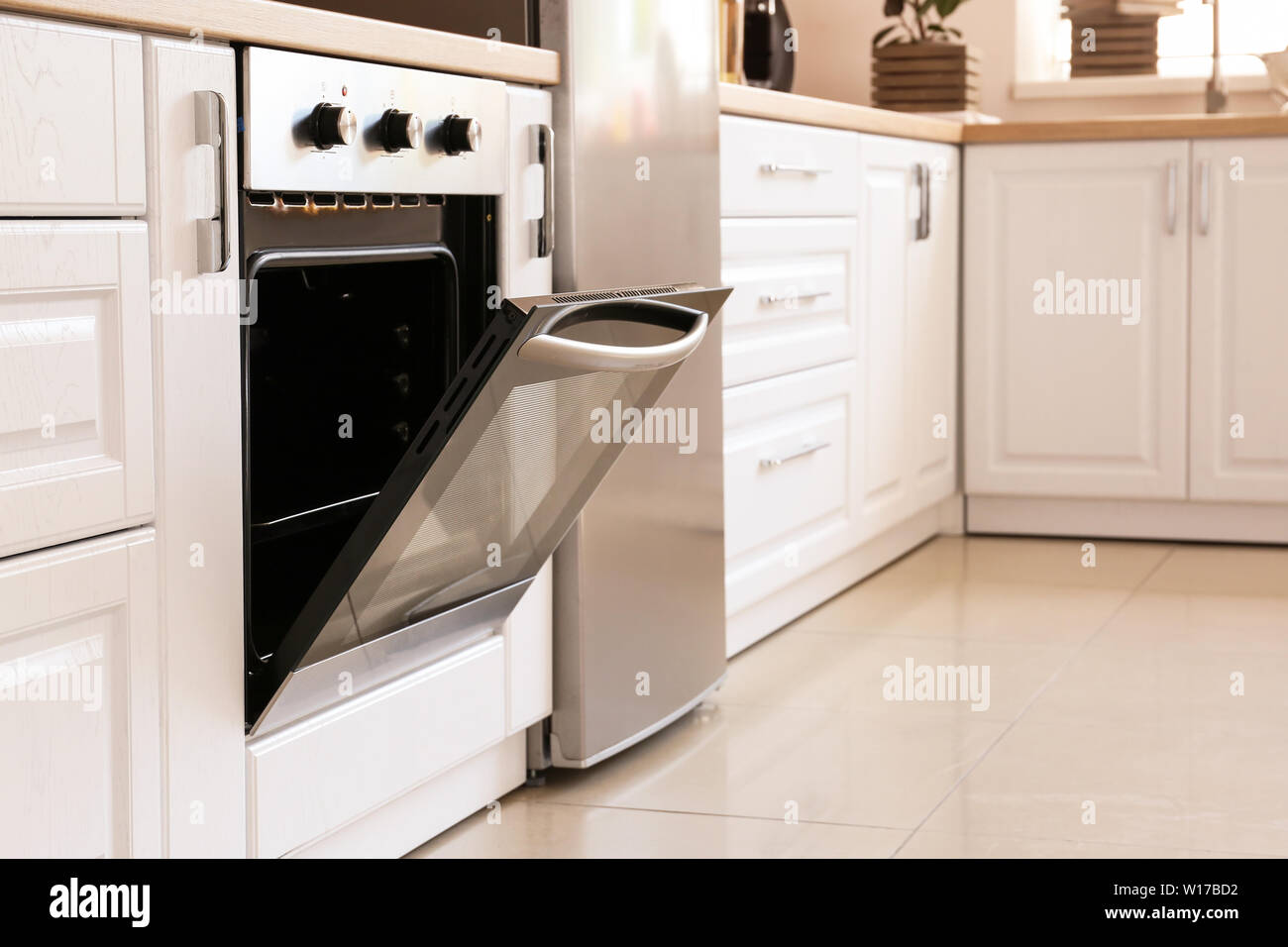 Modern open oven in kitchen Stock Photo - Alamy